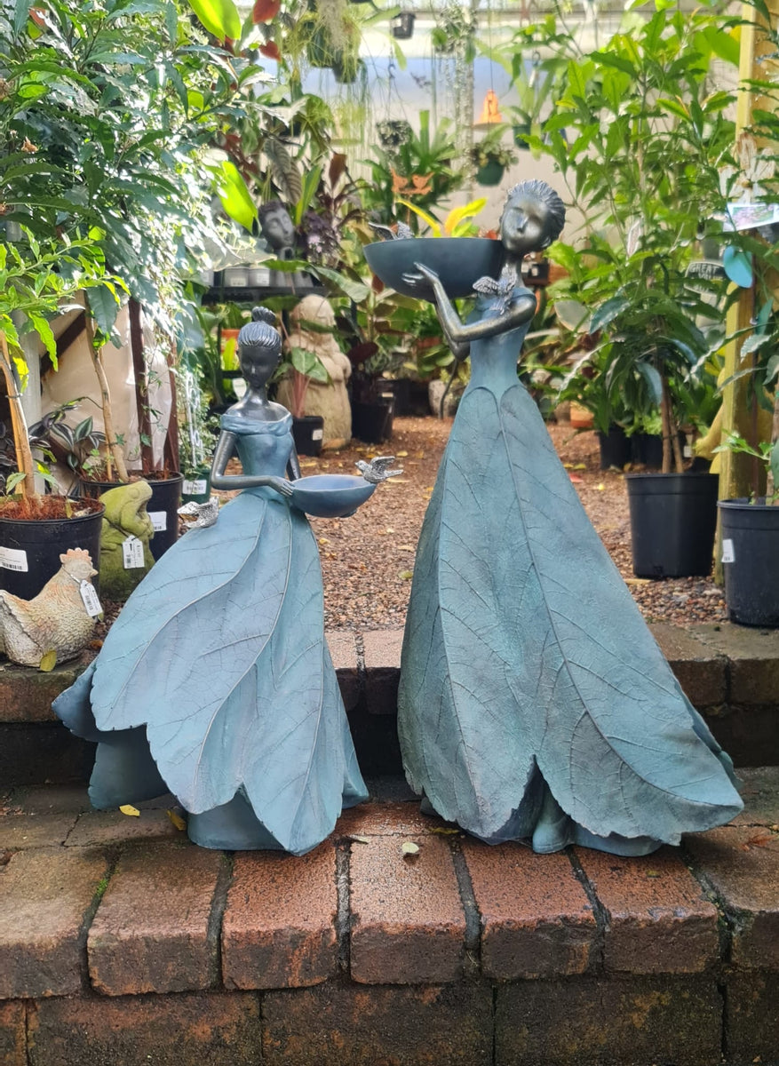 Odette Holding Bird Feeder At Waist – Mother Earth Nursery